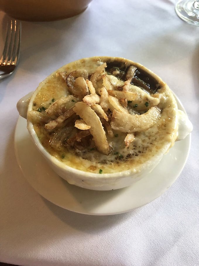 The legendary French onion soup arrives crowned with crispy onions and melted cheese&mdash;a bubbling cauldron of comfort that's worth the drive alone.