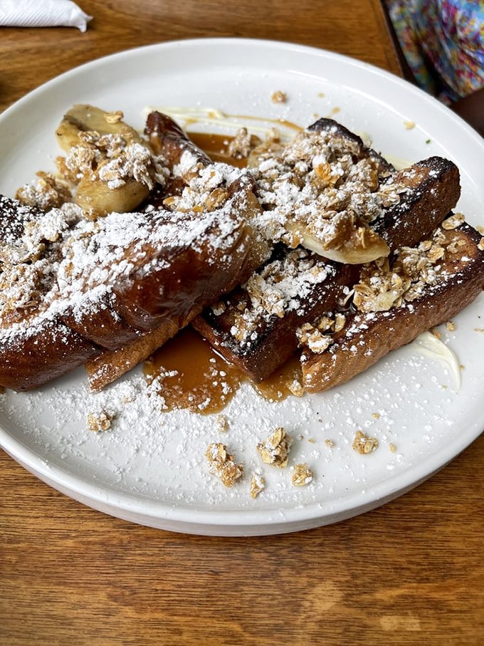 French toast that's dressed for the red carpet&mdash;caramelized bananas, powdered sugar, and granola create a breakfast that's thinking seriously about running for dessert.