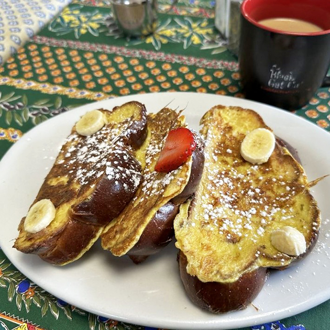 French toast that deserves its own Instagram account &ndash; golden-brown perfection topped with fresh fruit, powdered sugar, and pure breakfast joy.