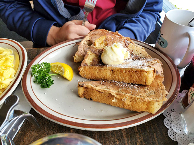 French toast that's achieved PhD-level perfection. Thick-cut bread transformed into a custard-centered masterpiece that makes you question all other breakfast choices.