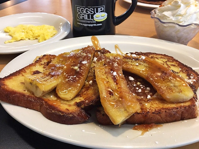 French toast elevated to an art form, topped with caramelized bananas and drizzled with syrup. This isn't breakfast&mdash;it's morning dessert disguised as nutrition.