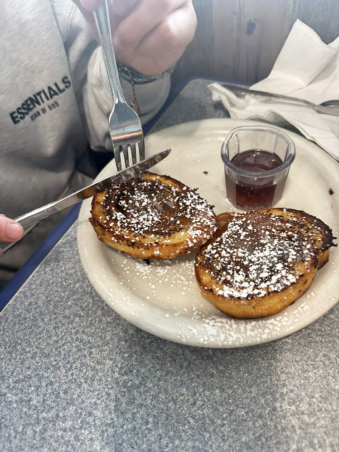 French toast perfection: golden-brown, dusted with powdered sugar, and worthy of its legendary status. Breakfast nirvana has never looked so good.
