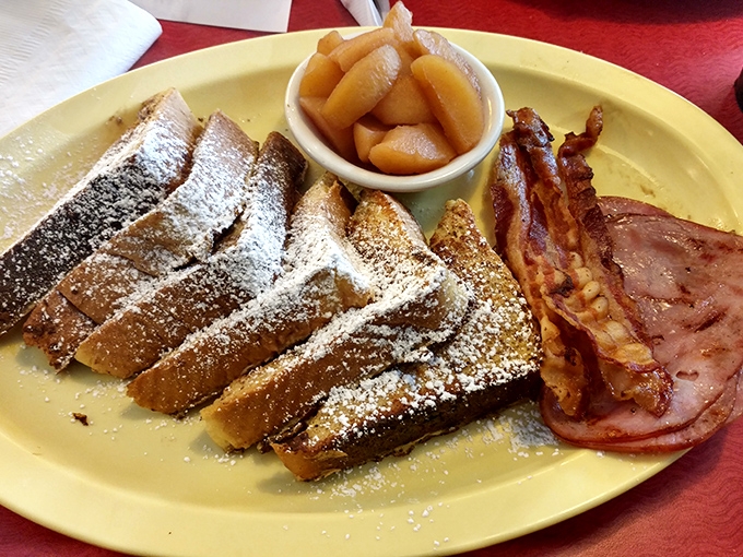 French toast that's achieved the perfect balance between crispy exterior and custardy interior, with a snowfall of powdered sugar that means business.