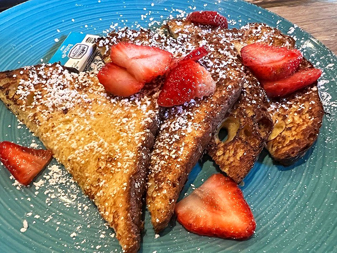 Golden-brown French toast that's achieved breakfast nirvana. Those fresh strawberries and powdered sugar aren't just toppings&mdash;they're the crown jewels.