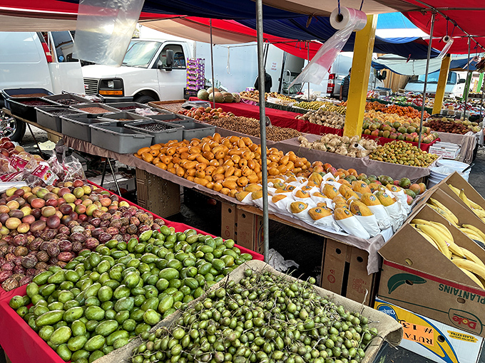 A cornucopia of fresh produce stretches as far as the eye can see—nature's color palette arranged in a mouthwatering display of seasonal abundance.