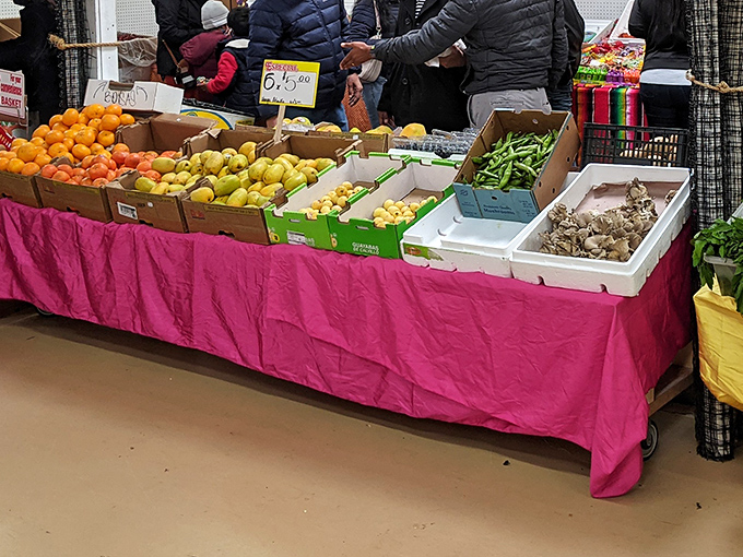 Farm-fresh produce brings a splash of color and nutrition amid the collectibles. These fruits and vegetables traveled fewer miles than most of the shoppers.