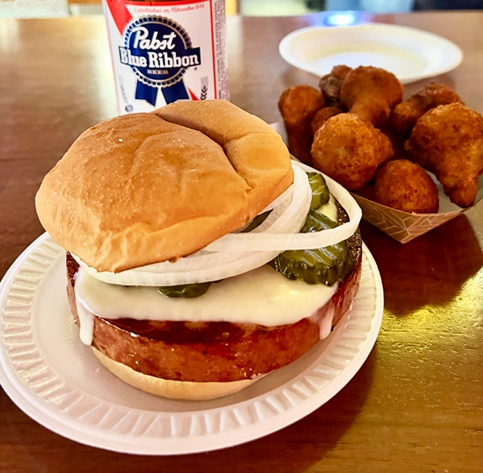 Behold the famous fried bologna sandwich in all its glory! Thick-cut, perfectly grilled, topped with cheese and pickles—this isn't your childhood lunch, it's the grown-up version.