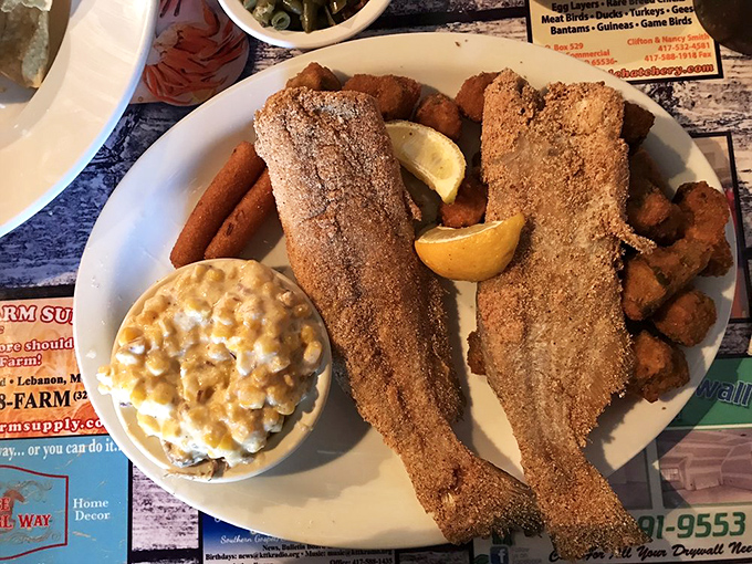 Golden-brown perfection on a plate. This catfish has the kind of crispy exterior and tender interior that food dreams are made of.