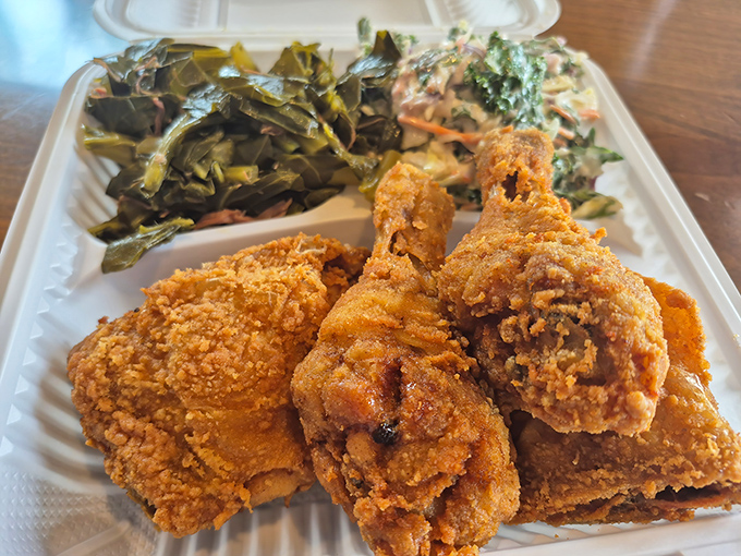 Behold, the holy trinity of fried chicken perfection: golden-brown crust, juicy meat, and sides that don't play second fiddle. This is what dreams are made of.
