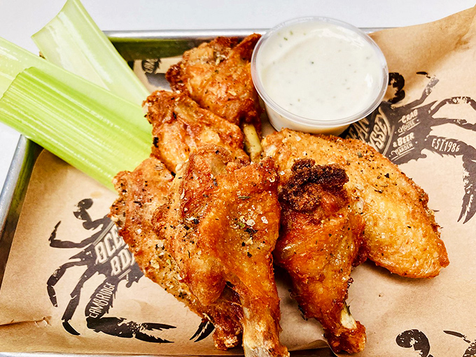 Golden-brown chicken wings that could make a crab jealous. Crispy on the outside, juicy on the inside&mdash;the unexpected star of a seafood joint.