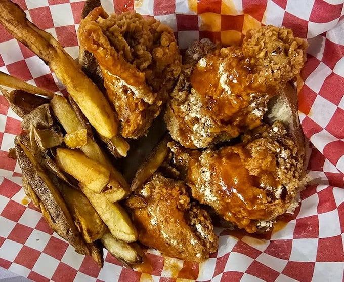 Golden-brown perfection nestled in a red checkered basket&mdash;this isn't just fried chicken, it's edible artwork with a side of hand-cut fries.