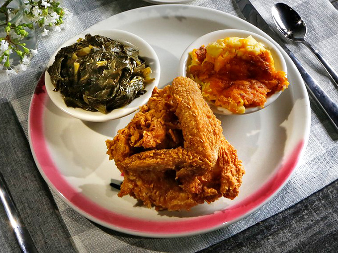 Golden-brown fried chicken that crackles with each bite, served alongside collard greens and mac and cheese&mdash;the holy trinity of Southern comfort.