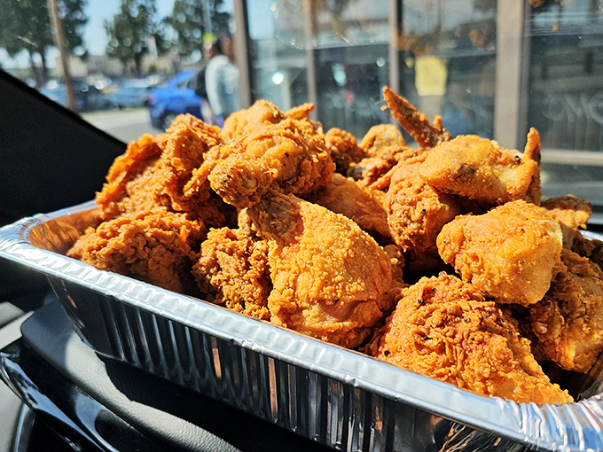 Golden-brown perfection in aluminum form. This isn't Instagram bait; it's the real deal&mdash;chicken that makes you forget your table manners and reach for another piece.
