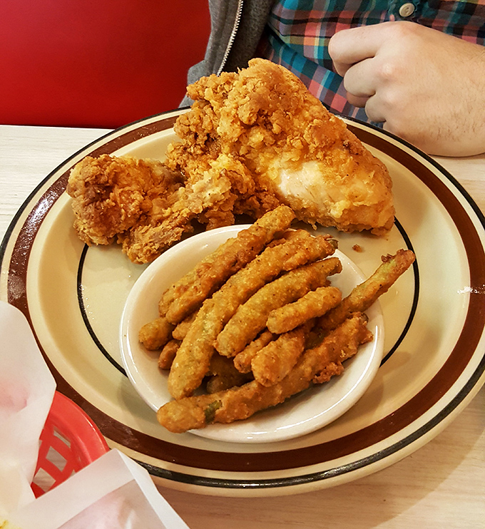 Golden-battered chicken that shatters with each bite, paired with crispy bean fingers that put ordinary fries in timeout.
