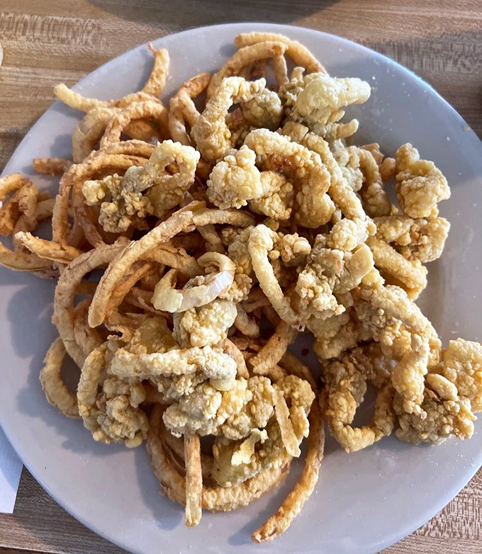 Golden treasures from the deep! These fried clams aren't just food&mdash;they're little crispy love letters from the ocean.