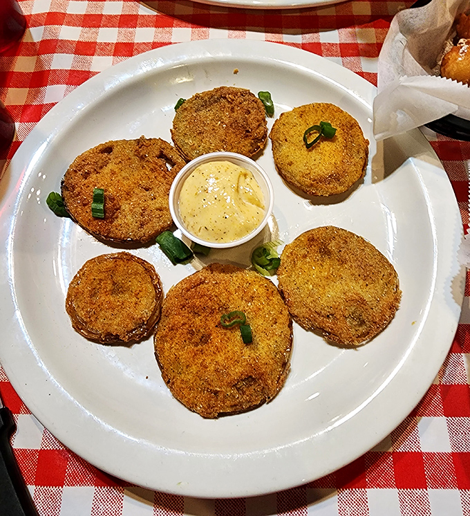 Golden-fried green tomatoes arranged like a delicious clock face, with remoulade sauce standing center stage. Southern cooking at its most addictive.
