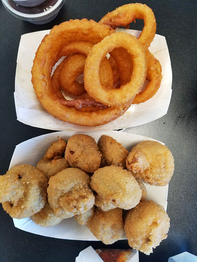 Golden halos of heaven! These hand-battered onion rings shatter with a satisfying crunch that will haunt your dreams in the best possible way.