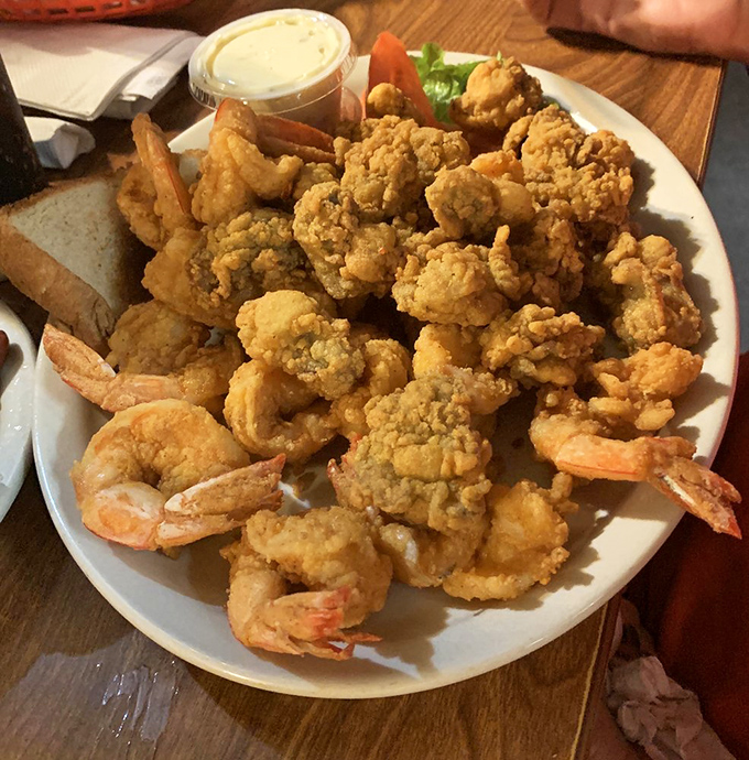 Golden treasures from the deep! This mountain of perfectly fried shrimp and oysters makes you wonder why anyone bothers with fancy food.