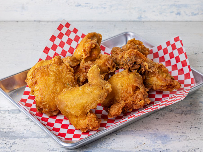 Golden armor of crispy batter protecting juicy treasure within. This isn't just fried chicken—it's edible artwork with a soundtrack of satisfying crunch.