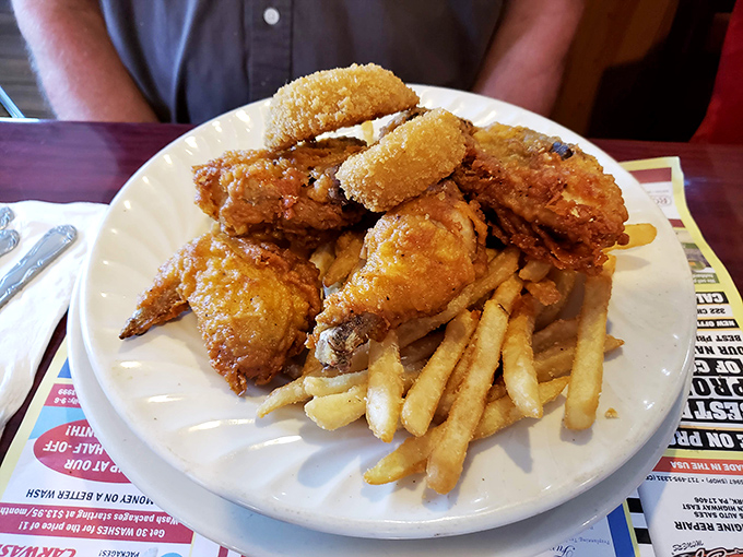 Golden-brown fried chicken that crackles with each bite, paired with fries that could make a Frenchman weep. Comfort food that speaks a universal language.