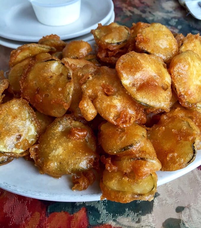Golden-fried pickle chips that shatter with each bite, revealing tangy dill centers. These aren't just appetizers&mdash;they're conversation stoppers.
