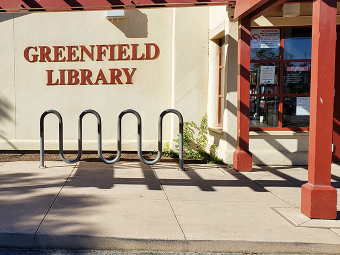 The Greenfield Library welcomes bibliophiles with its no-nonsense bike rack&mdash;park your Schwinn and swap your screen time for page-turning.