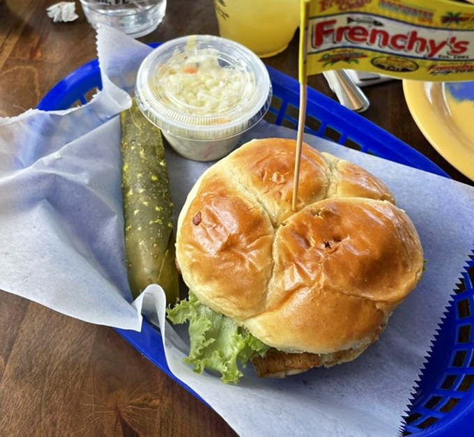 Behold the star of the show&mdash;a grouper sandwich so perfect it should have its own agent. That golden bun barely contains the glory within.