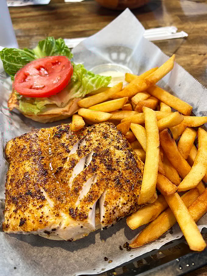 Blackened perfection meets golden fries. This fish sandwich doesn't need fancy plating&mdash;it's too busy preparing to make your taste buds stand at attention.