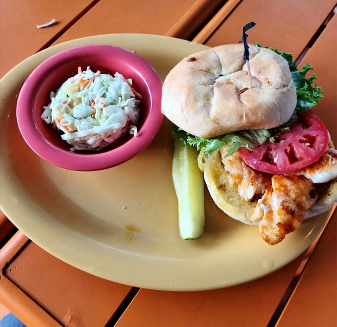 This isn't just a sandwich&mdash;it's Florida on a bun. Golden-battered grouper, crisp veggies, and that telltale pickle spear announce: vacation starts now.