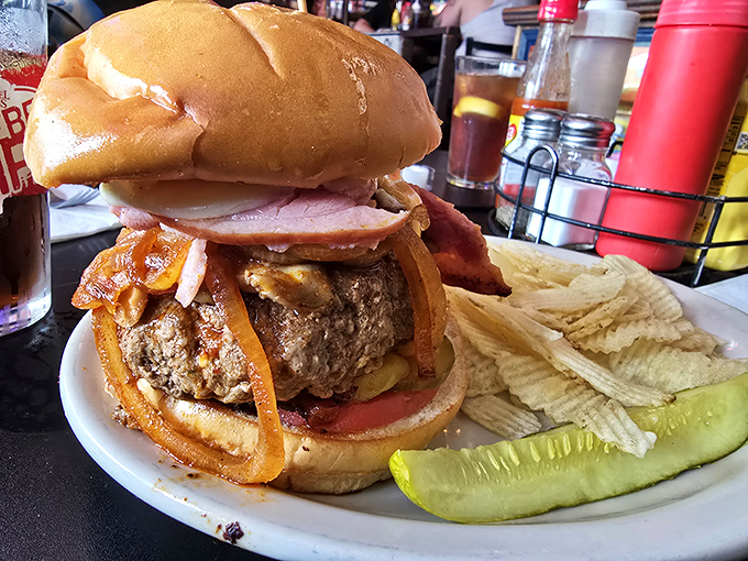 Architecture in burger form&mdash;layers of beef, cheese, and toppings creating a savory skyscraper that requires both hands and possibly engineering skills to consume.