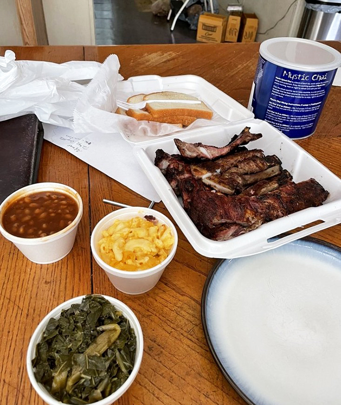 Meat and sides in perfect harmony&mdash;like a barbecue symphony where ribs are the conductor. Those collard greens deserve their own fan club. 