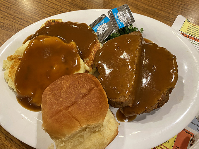 Meatloaf smothered in rich brown gravy alongside creamy mashed potatoes. Grandma would approve of this plate&mdash;and probably ask for seconds.