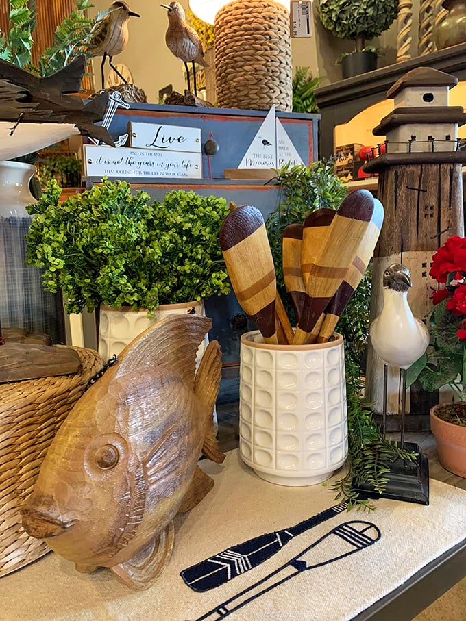 Wooden paddles and carved fish—because nothing says "lake house chic" quite like decorations that could theoretically catch dinner.