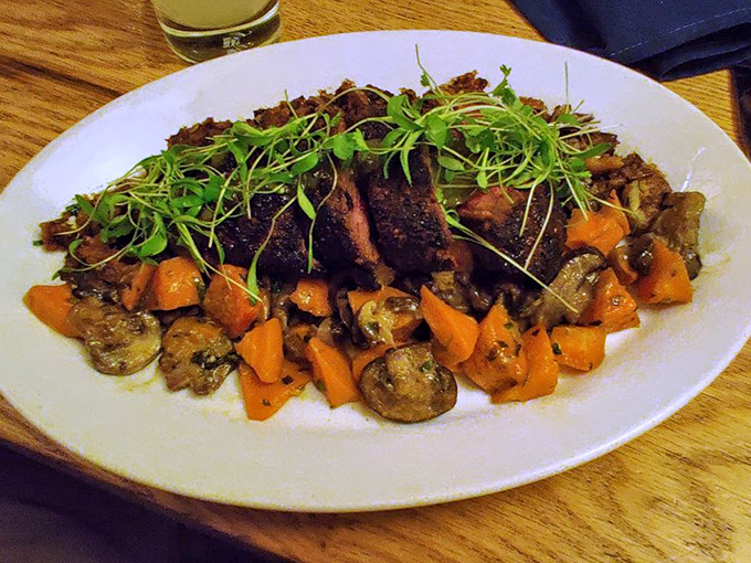 Hanger steak that doesn't just hang around—it commands attention. Those roasted vegetables aren't sidekicks; they're co-stars in this plate's delicious drama.