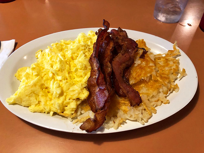 Behold the star attraction: hash browns that achieve the impossible balance of crispy exterior and tender interior. Worth every mile of your journey.