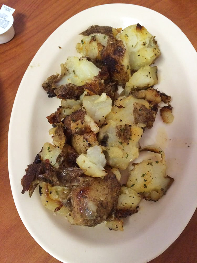 These aren't just home fries; they're potato perfection that would make your grandmother both proud and jealous. Crispy edges, tender centers, seasoned just right.