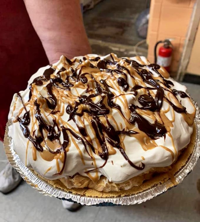 This isn't just pie&mdash;it's therapy with whipped cream. Chocolate and peanut butter drizzles dance across the top like they're auditioning for dessert stardom.