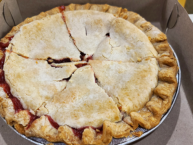 This isn't just pie&mdash;it's edible architecture with a perfectly crimped crust and ruby filling peeking through deliberate vents. Grandmothers everywhere would approve.