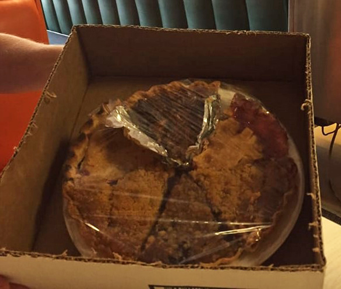 Pie to go? The cardboard box serves as a humble chariot for what might be the most important passenger you'll transport all day.