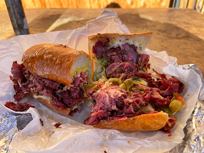 This hot pastrami isn't just a sandwich&mdash;it's a masterpiece of meat architecture that requires both hands and possibly a bib.