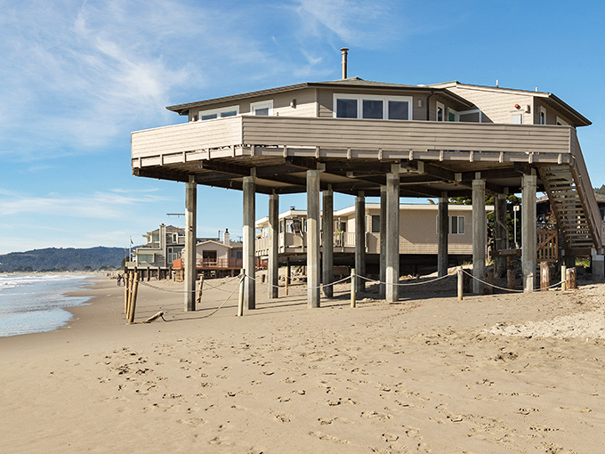 Beach houses on stilts stand like patient fishermen, waiting for high tide while offering their occupants front-row seats to nature's greatest show.