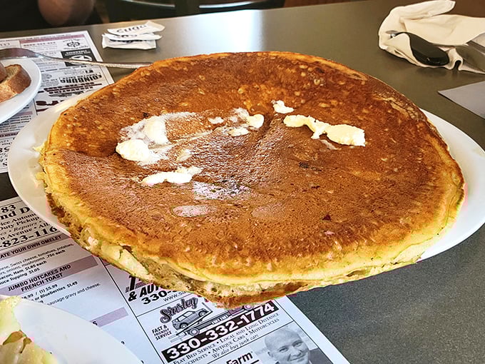 This pancake doesn't just hang over the edge of the plate&mdash;it's practically filing for its own zip code.