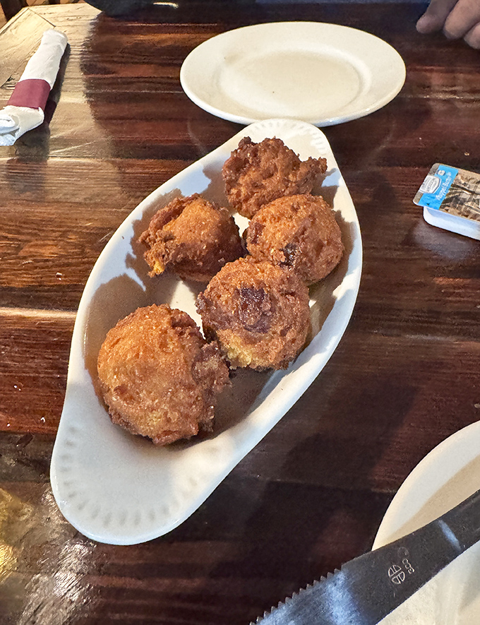The legendary hush puppies in their natural habitat. Golden-brown orbs of cornmeal perfection that might just be worth crossing state lines for.