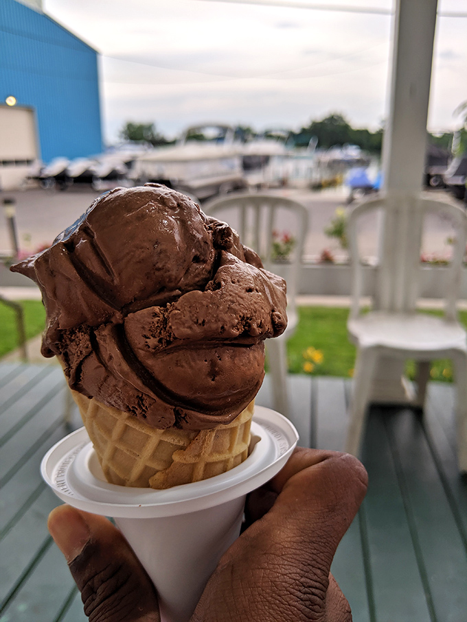 This chocolate cone isn't just dessert, it's architecture – towering scoops that defy both gravity and your willpower to save room.