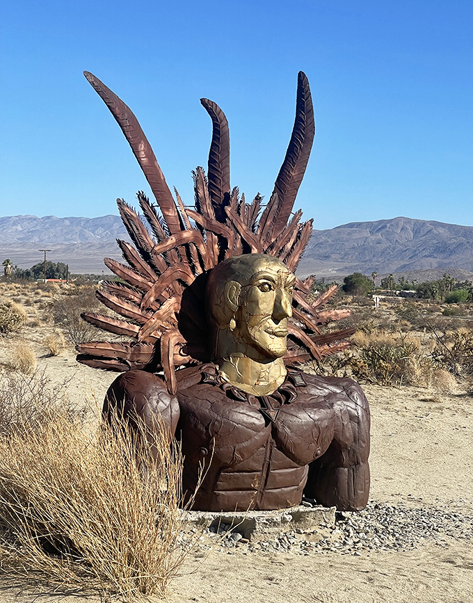Part guardian, part desert deity. This indigenous-inspired sculpture wears a crown of metal feathers that seem to rustle in the desert breeze.