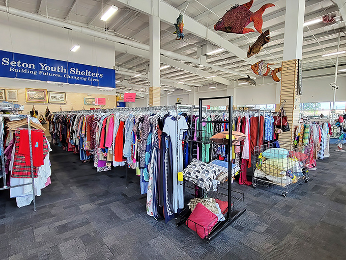 Endless racks organized by color create a rainbow of possibilities. Somewhere in this textile sea swims your perfect find.