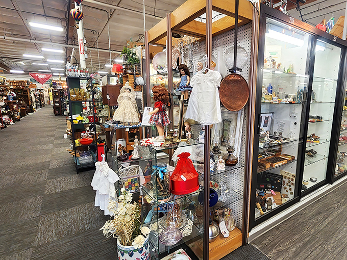 Vintage dolls and delicate glassware stand sentinel in this booth, silently telling stories of childhoods past and dinner parties long concluded.