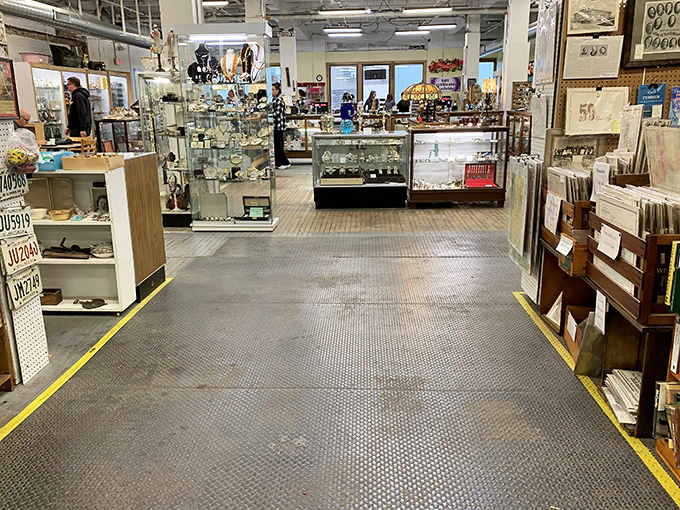 Display cases gleam under industrial lighting, offering glimpses of collectibles that survived countless spring cleanings and estate sales to find new admirers.