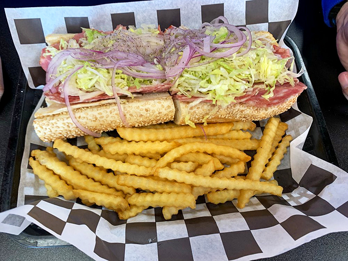Architecture of deliciousness&mdash;behold the Italian hoagie in its natural habitat. That shredded lettuce cascade is nothing short of poetry.