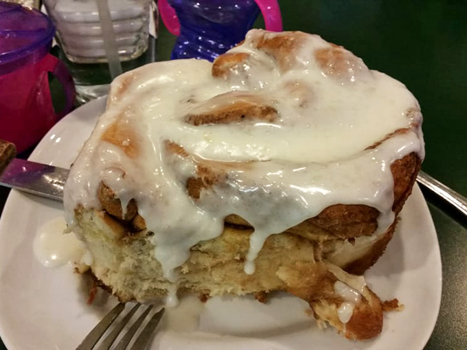 Behold the magnificent cinnamon roll&mdash;so gloriously frosted it could qualify for its own ZIP code. This isn't breakfast; it's a religious experience.